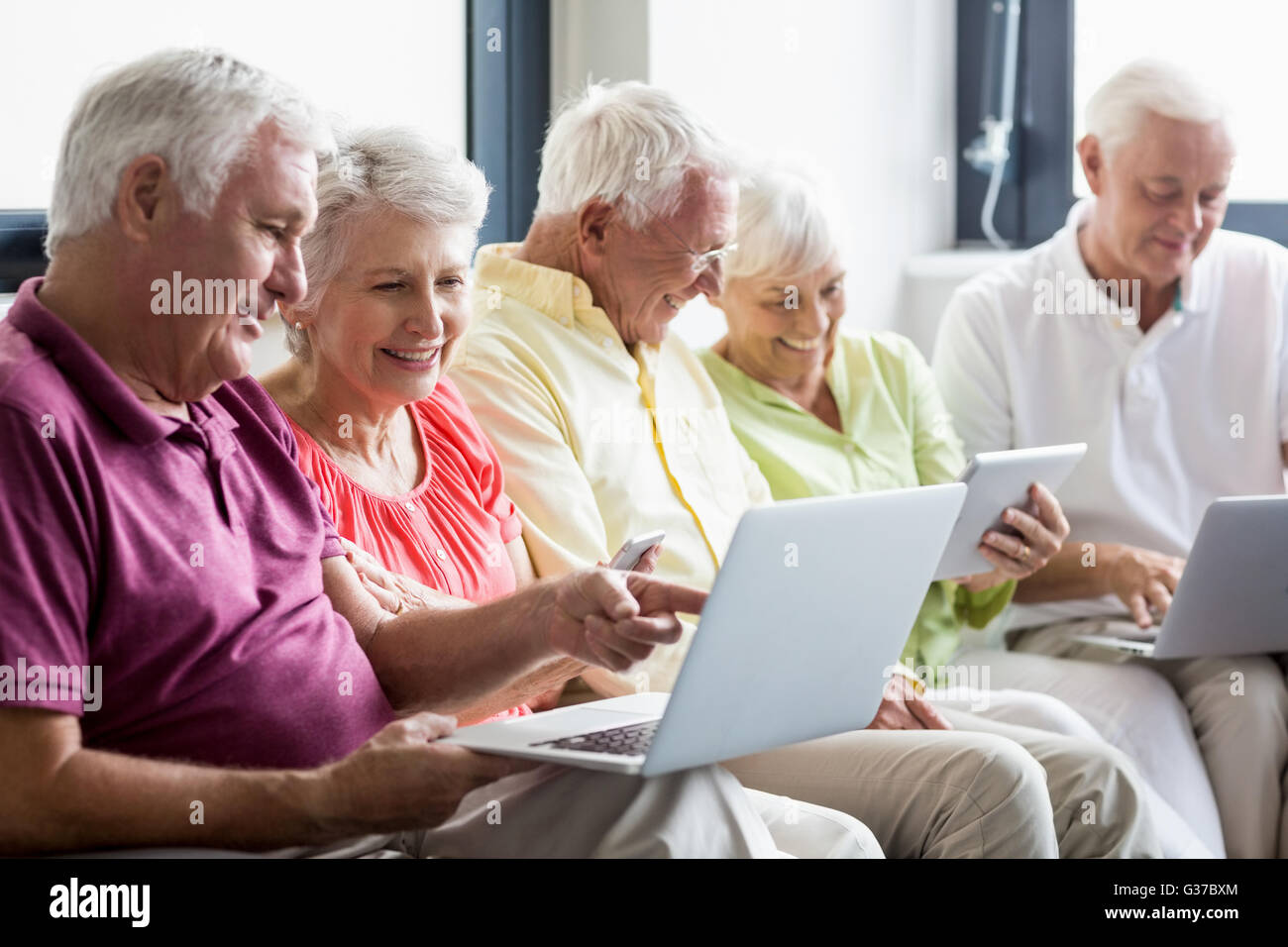 Seniors using technology Stock Photo - Alamy