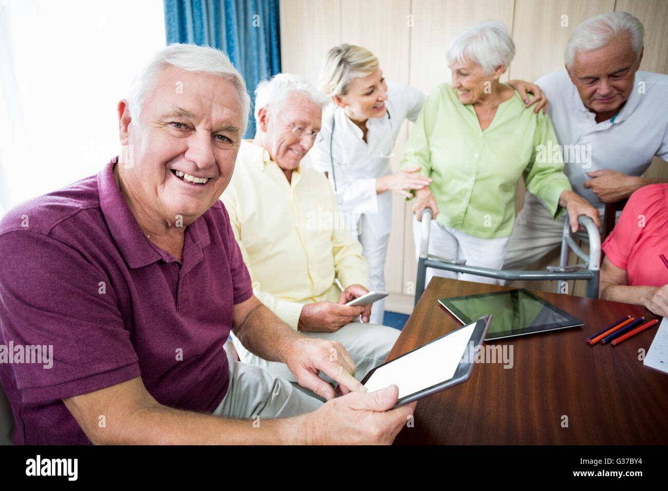 Seniors using technology Stock Photo - Alamy