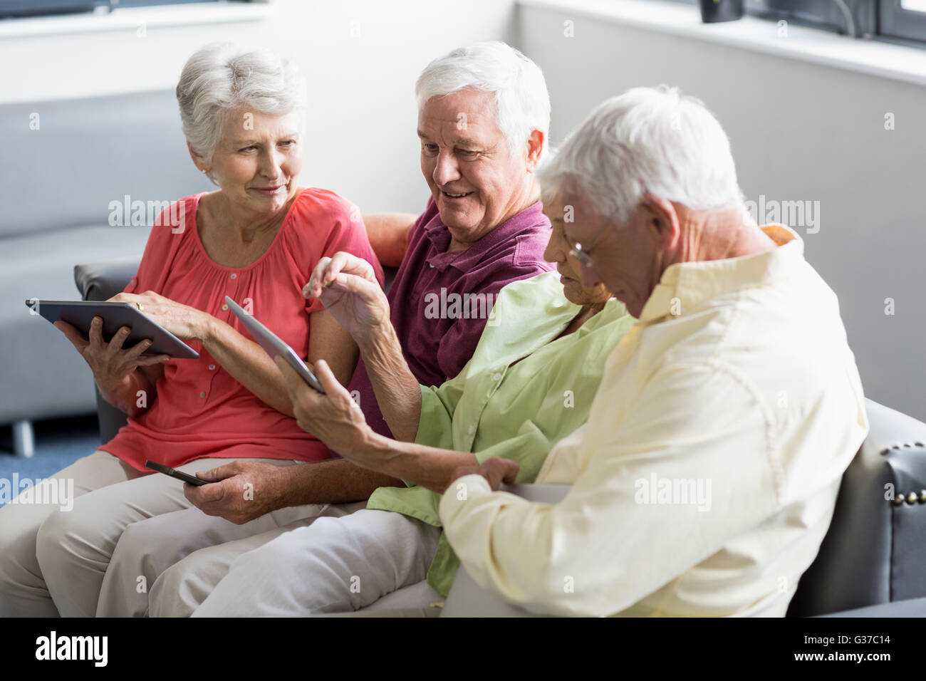 Seniors using tablets Stock Photo - Alamy