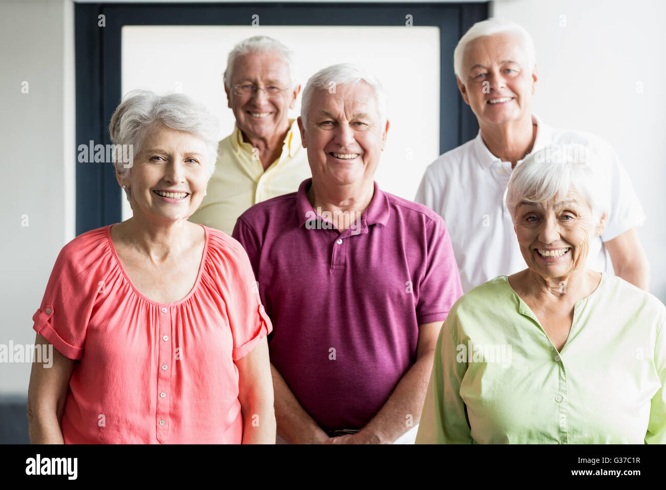 Seniors standing together Stock Photo - Alamy