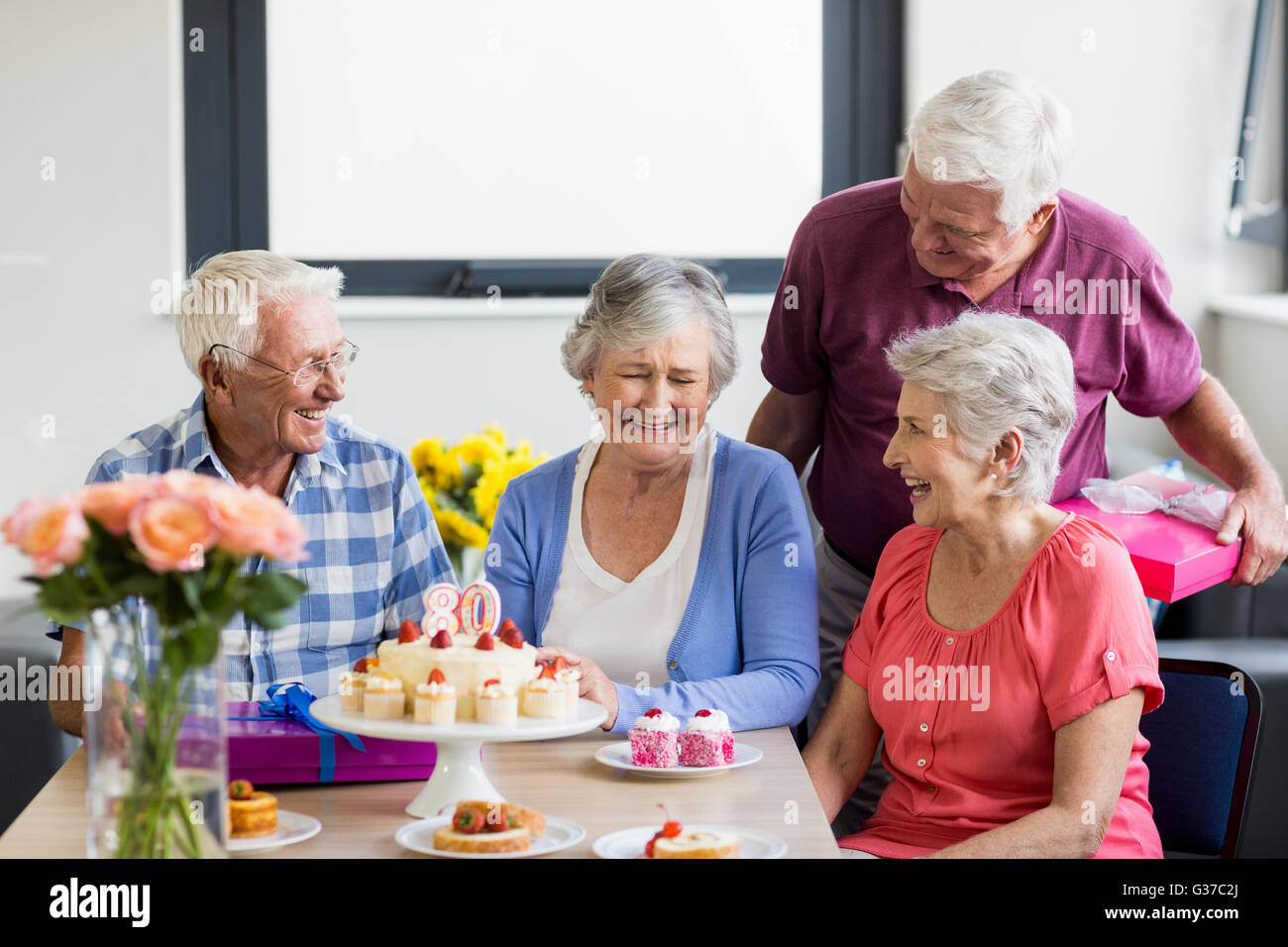 Seniors celebrating a birthday Stock Photo - Alamy