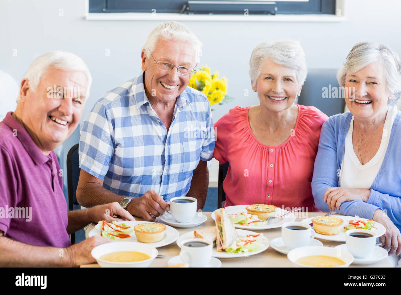 Seniors having lunch together Stock Photo - Alamy