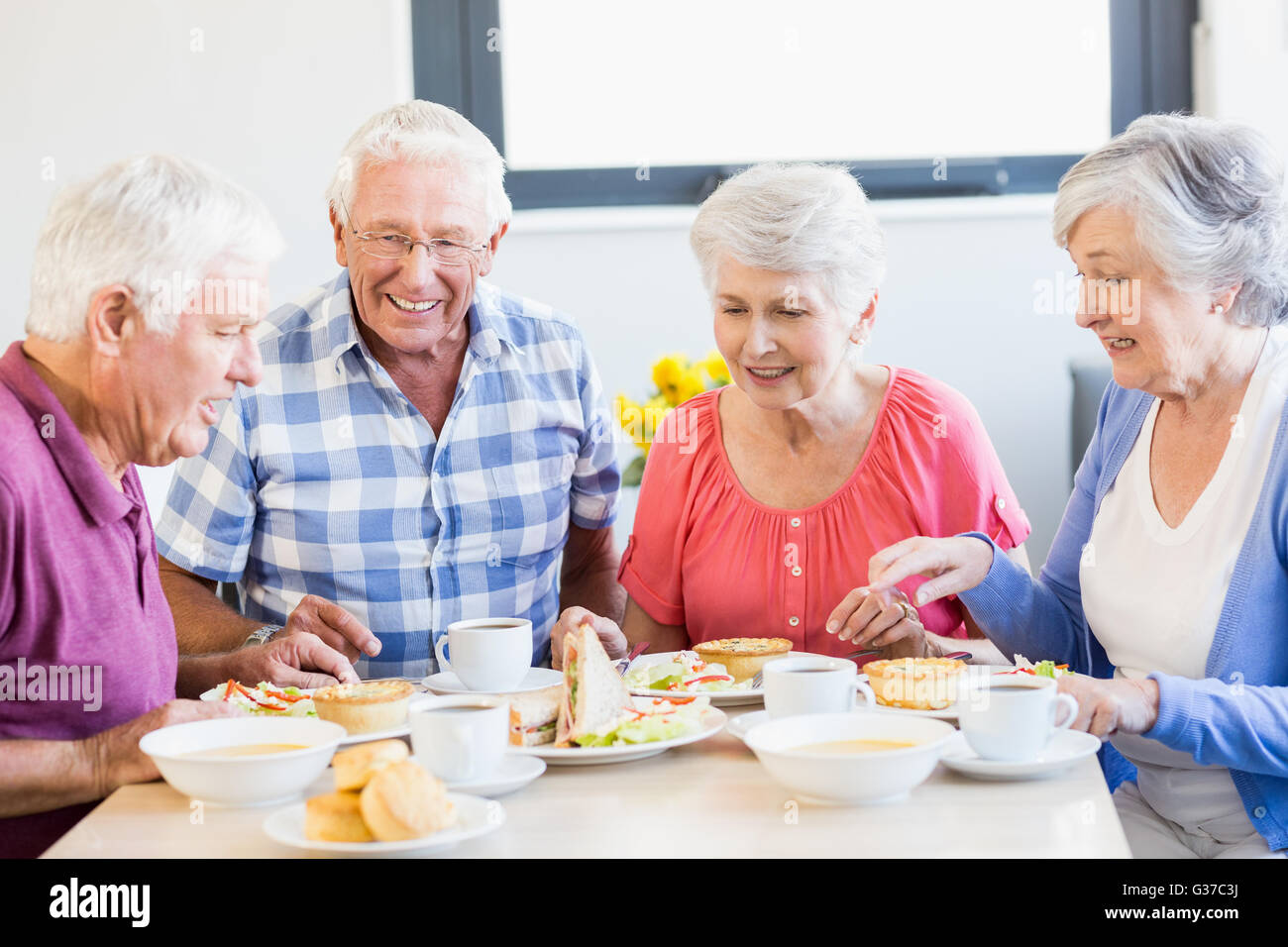 Seniors having lunch together Stock Photo - Alamy