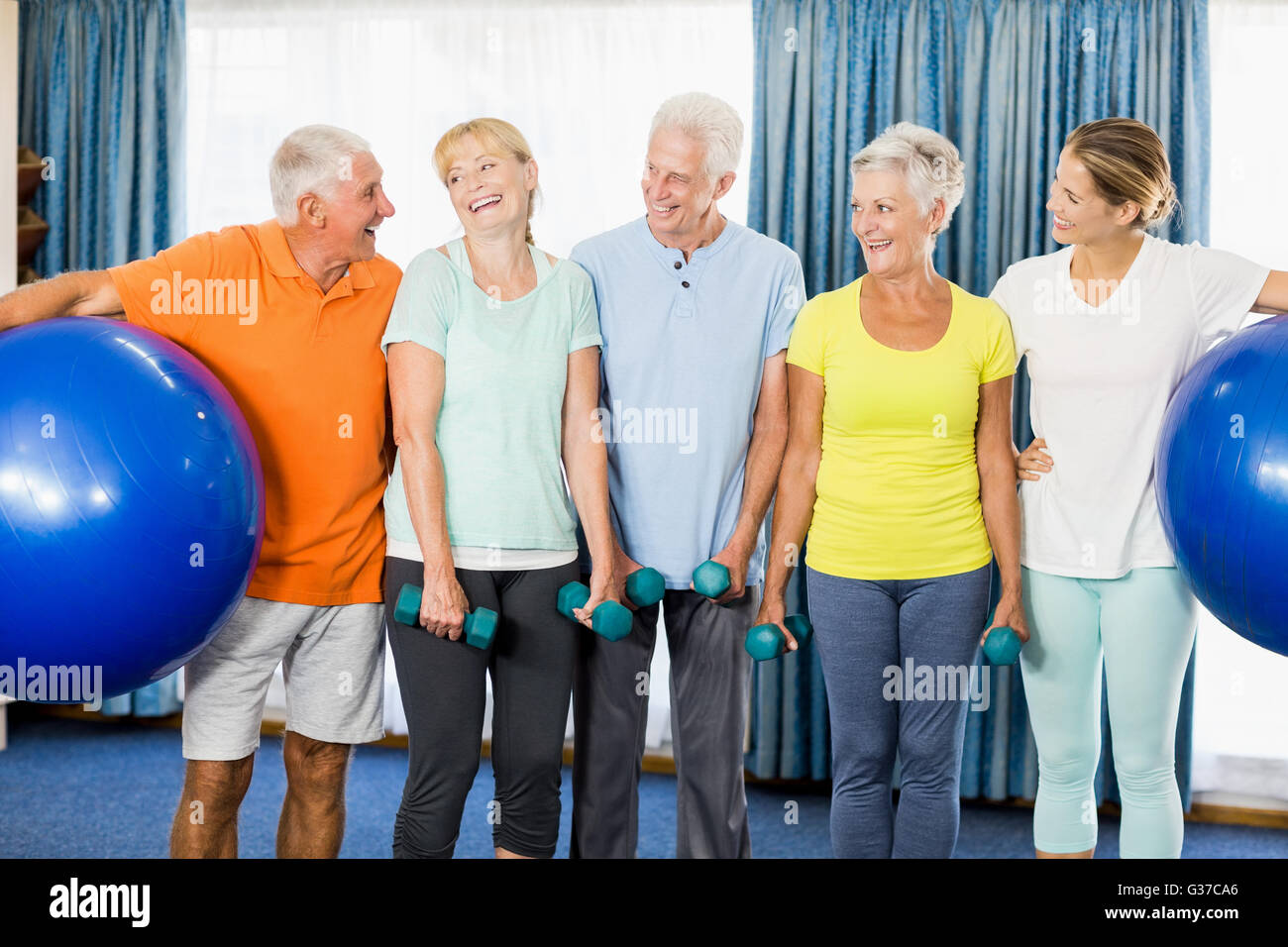 Instructor holding medicine ball hi-res stock photography and images ...