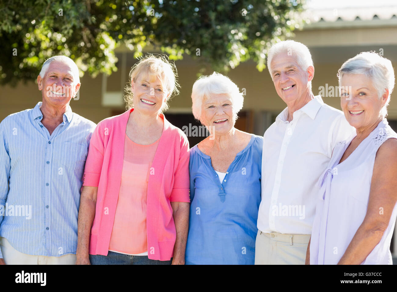 Seniors standing together Stock Photo - Alamy