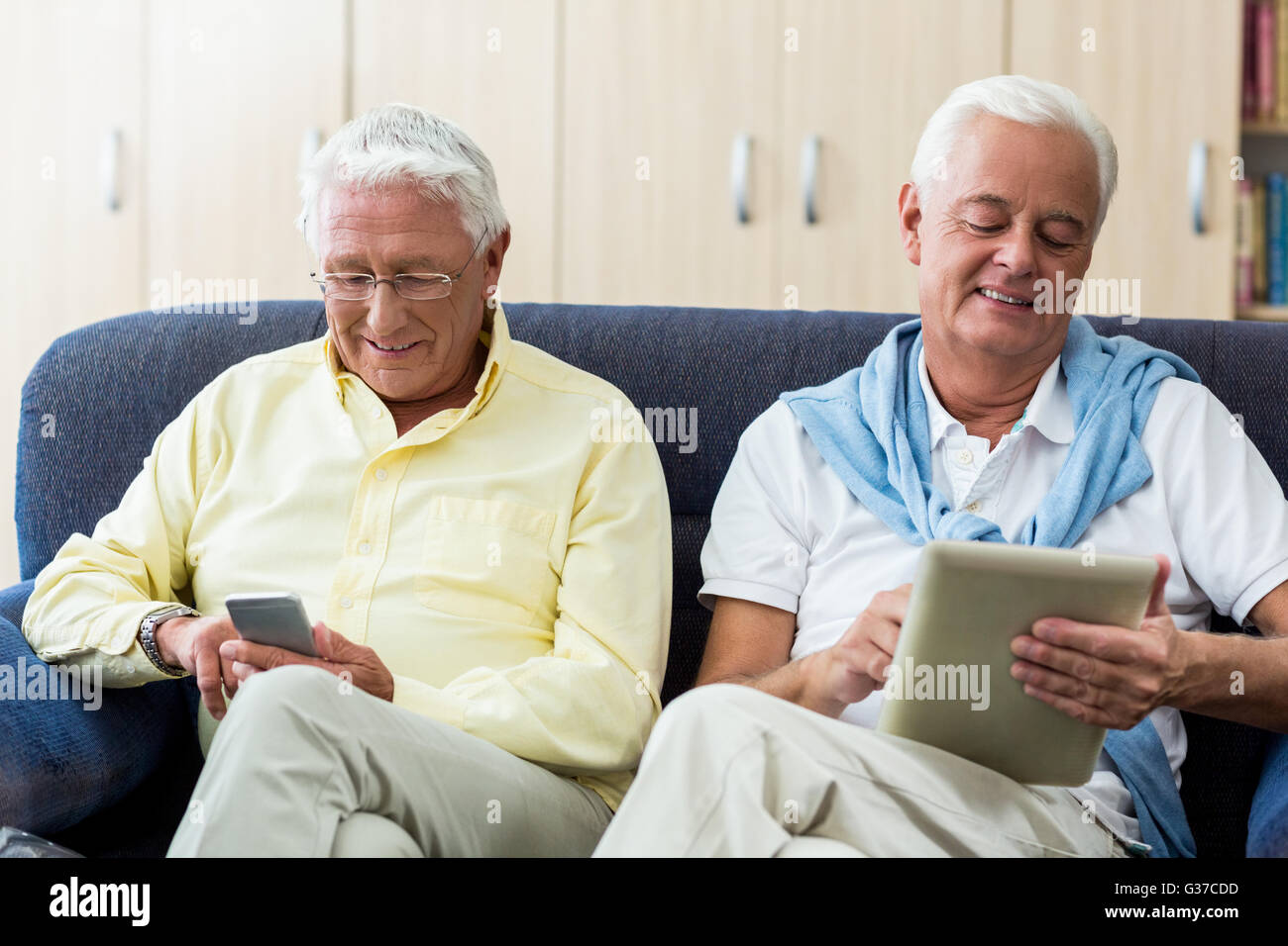 Senior men using technology Stock Photo - Alamy