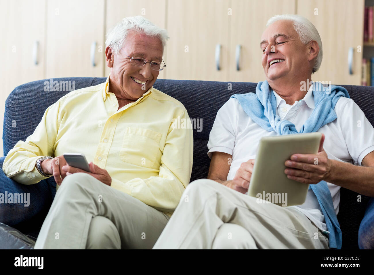 Senior men using technology Stock Photo - Alamy