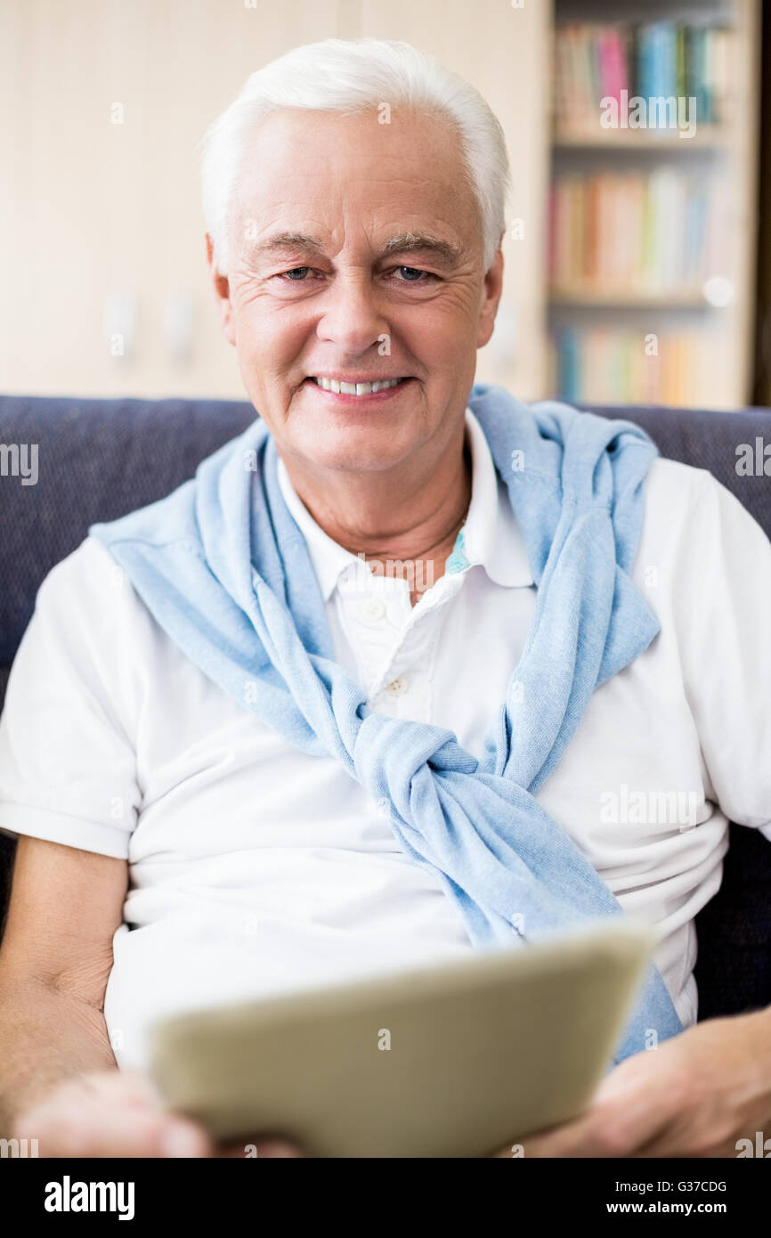Senior using a tablet Stock Photo - Alamy