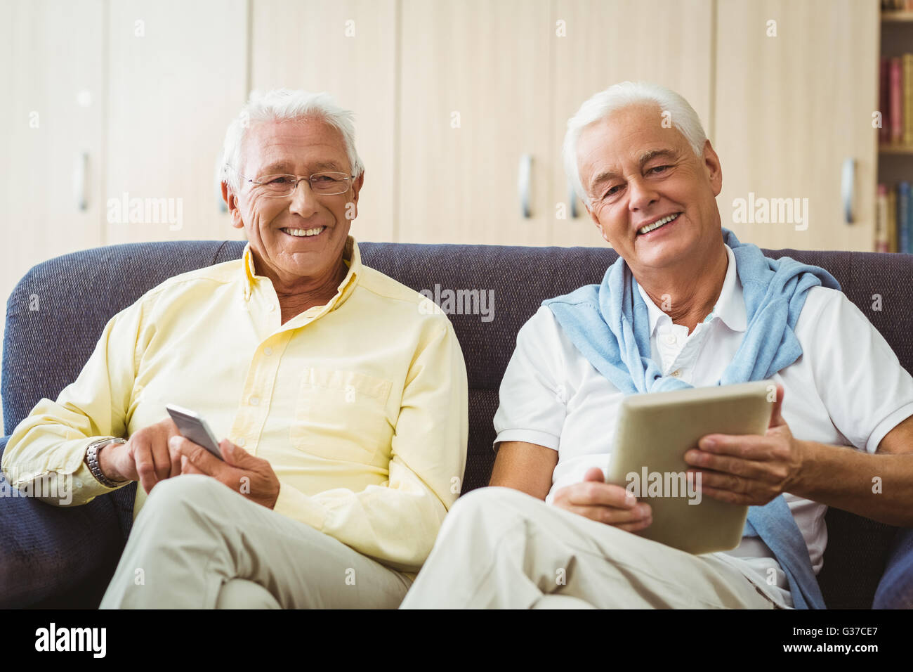 Senior men using technology Stock Photo - Alamy