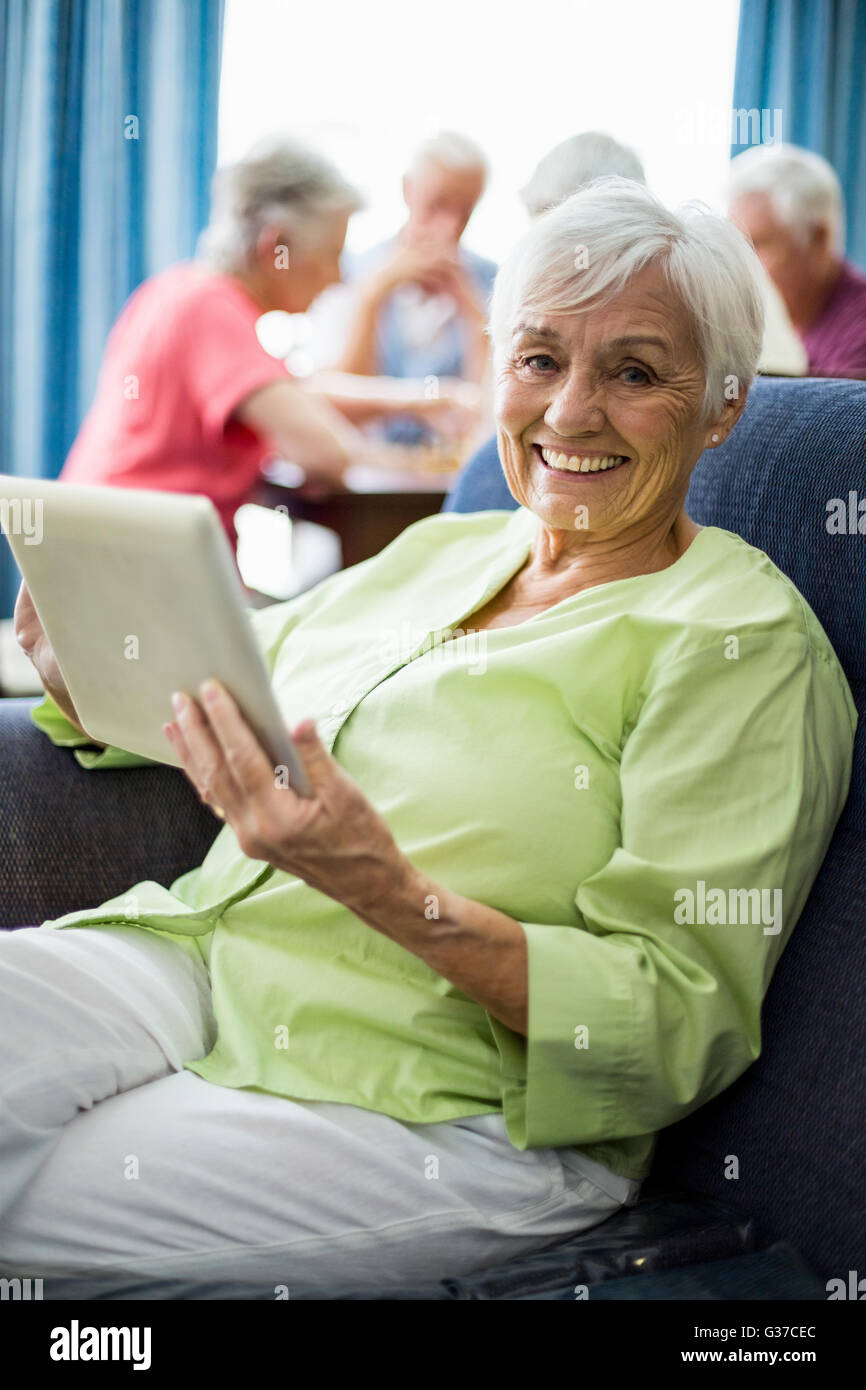 Senior woman using a tablet Stock Photo - Alamy