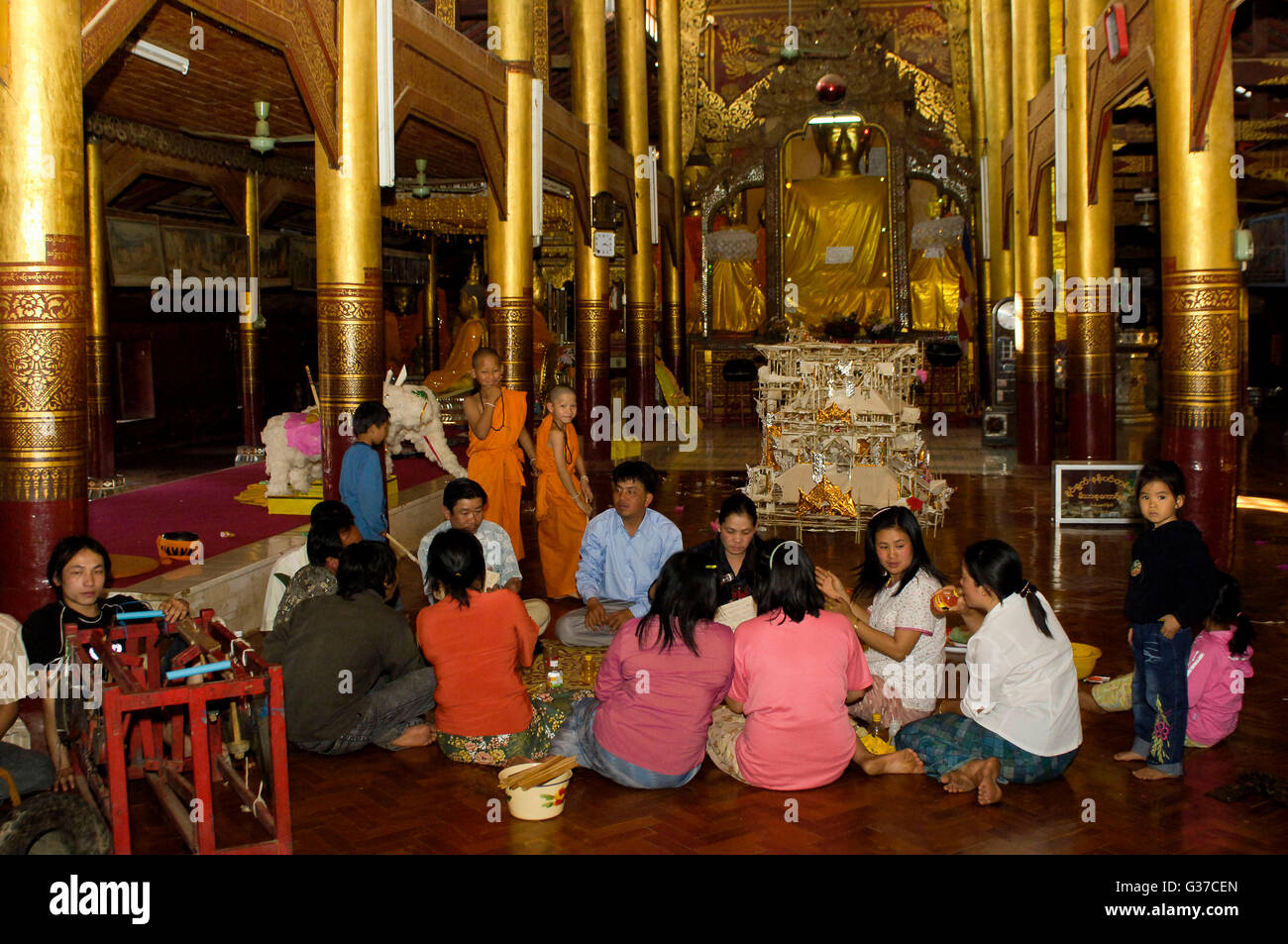 The gilded WAT JONG KHAM - KENGTUNG also known as MYANMAR a family ...