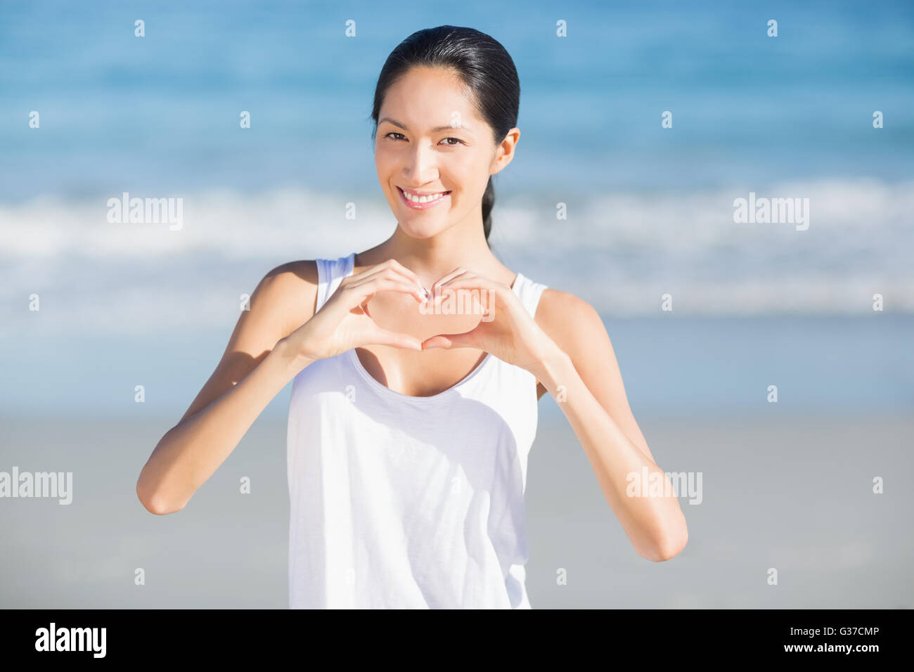 Heart shape beautiful young woman hi-res stock photography and images ...