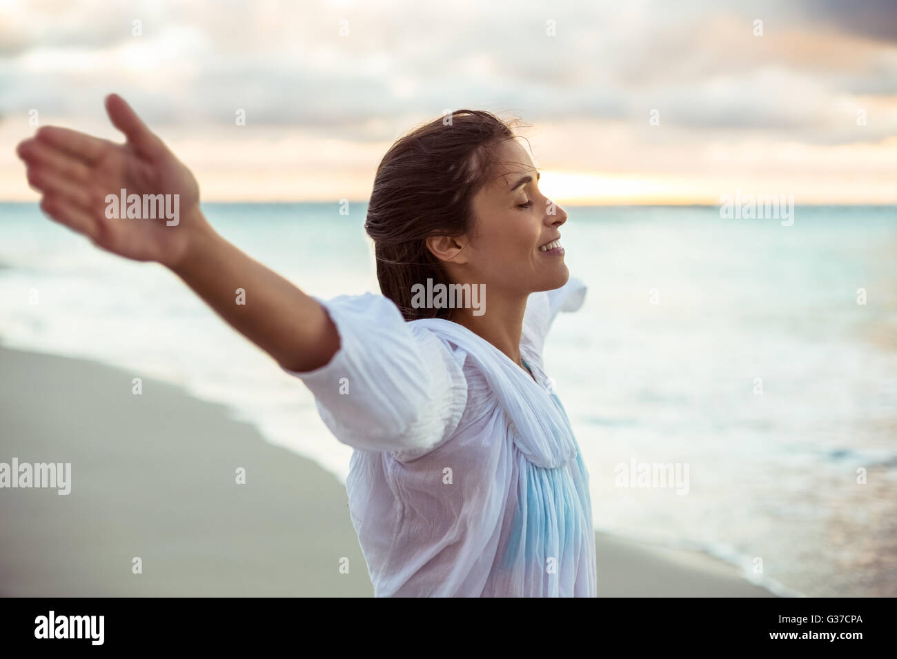 Woman stretching out her arms Stock Photo - Alamy