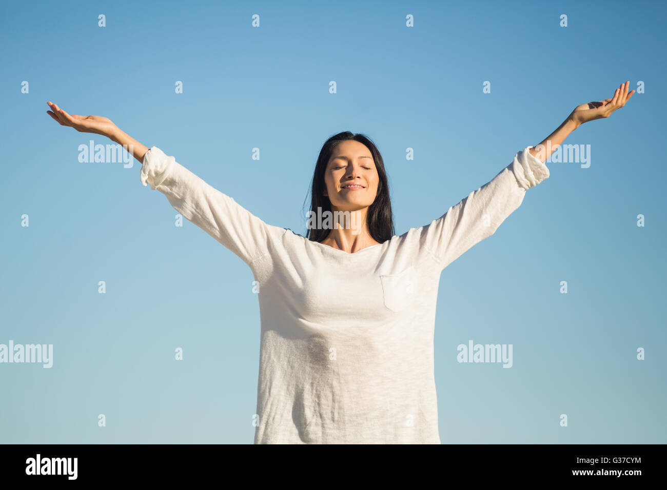 Female standing stretching arms out hi-res stock photography and images ...