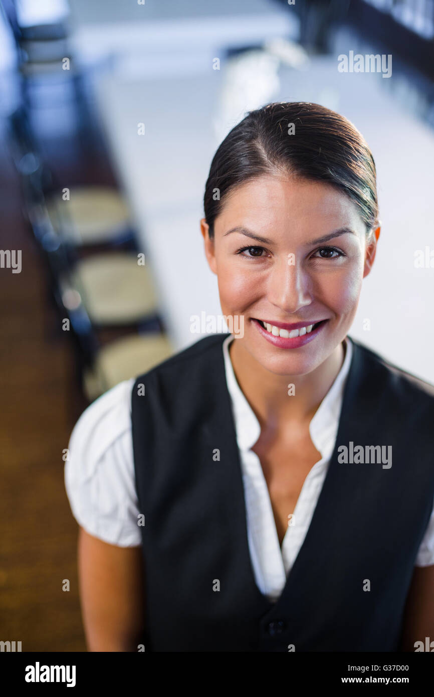 Portrait of smiling waitress Stock Photo - Alamy