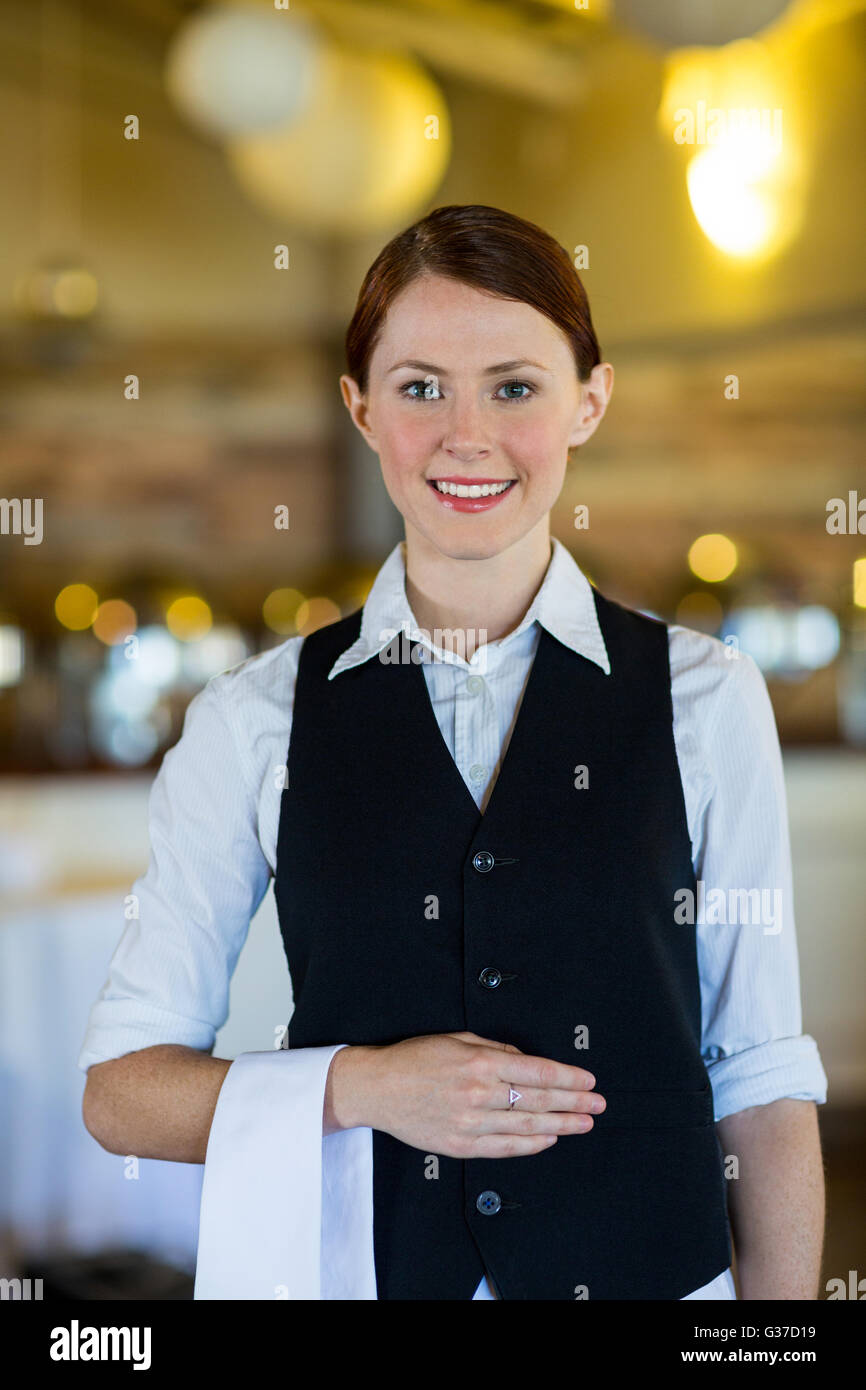 Waitress with napkin draped over her hand Stock Photo - Alamy