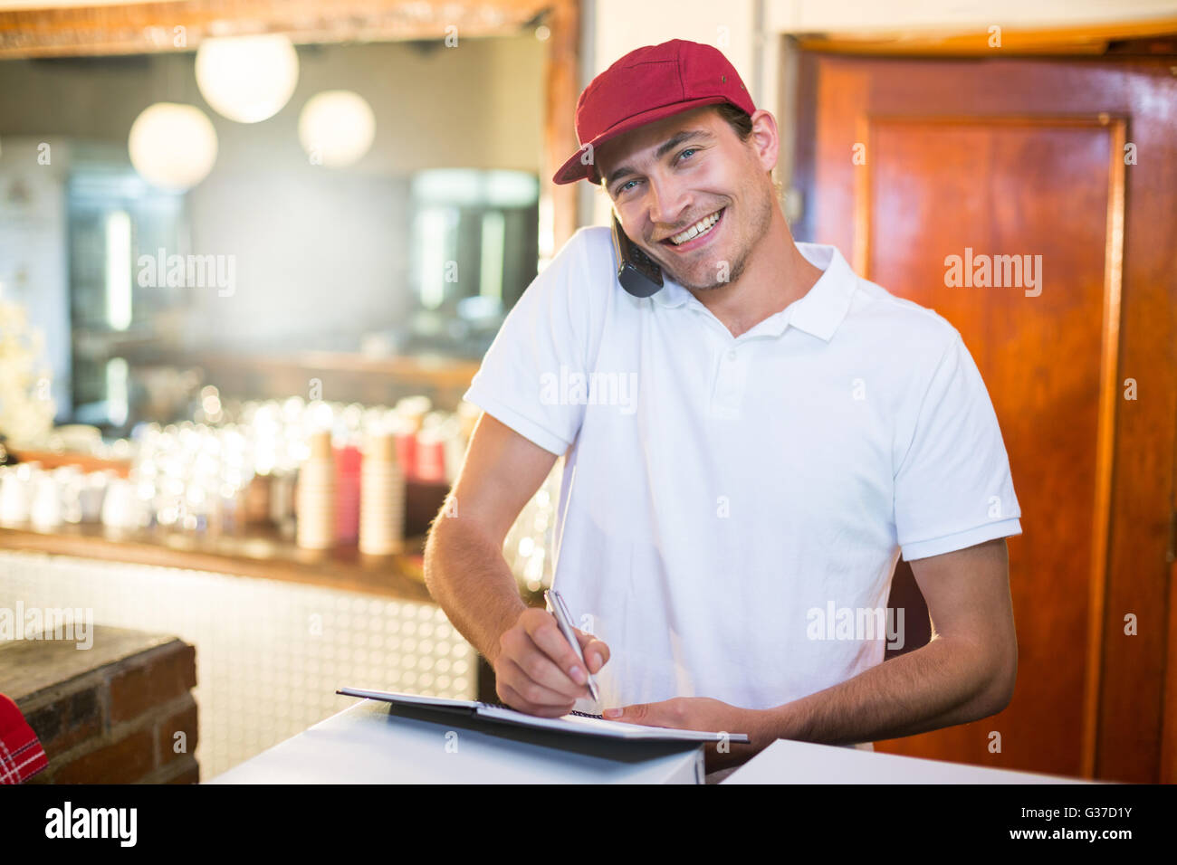 Man worker counter taking order hi-res stock photography and images - Alamy