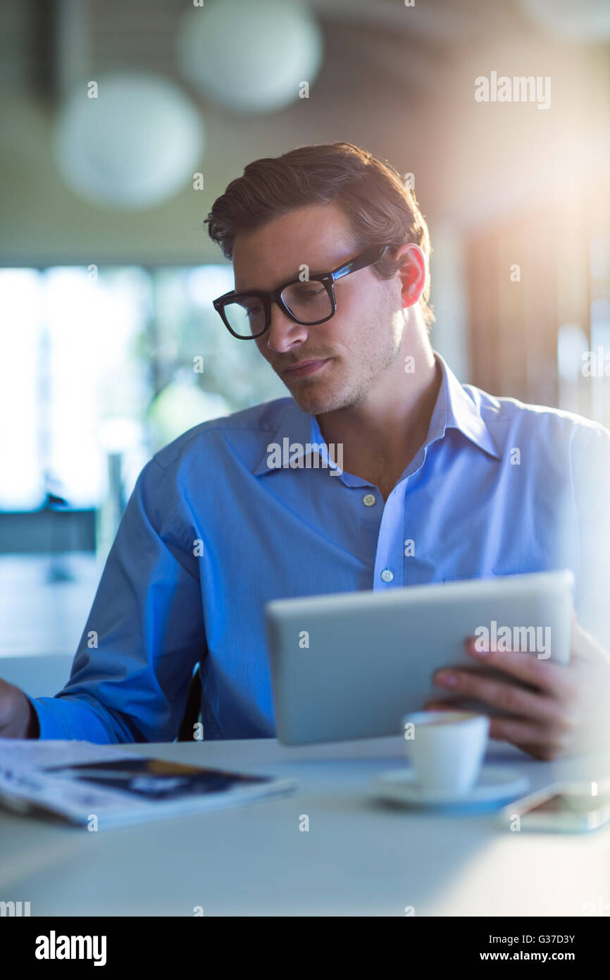 Man using digital tablet Stock Photo - Alamy