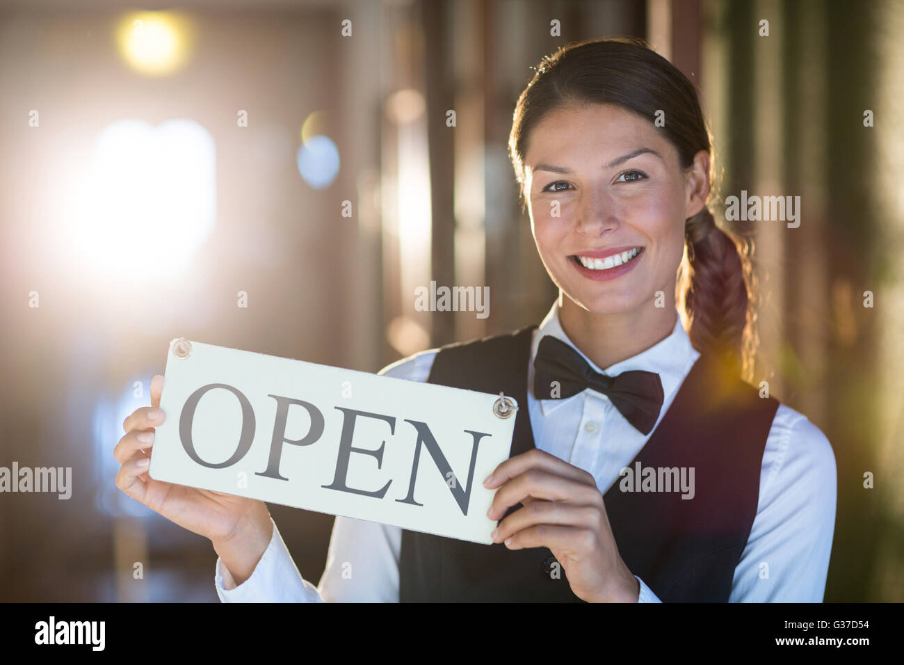 Portrait waitress showing open hi-res stock photography and images - Alamy