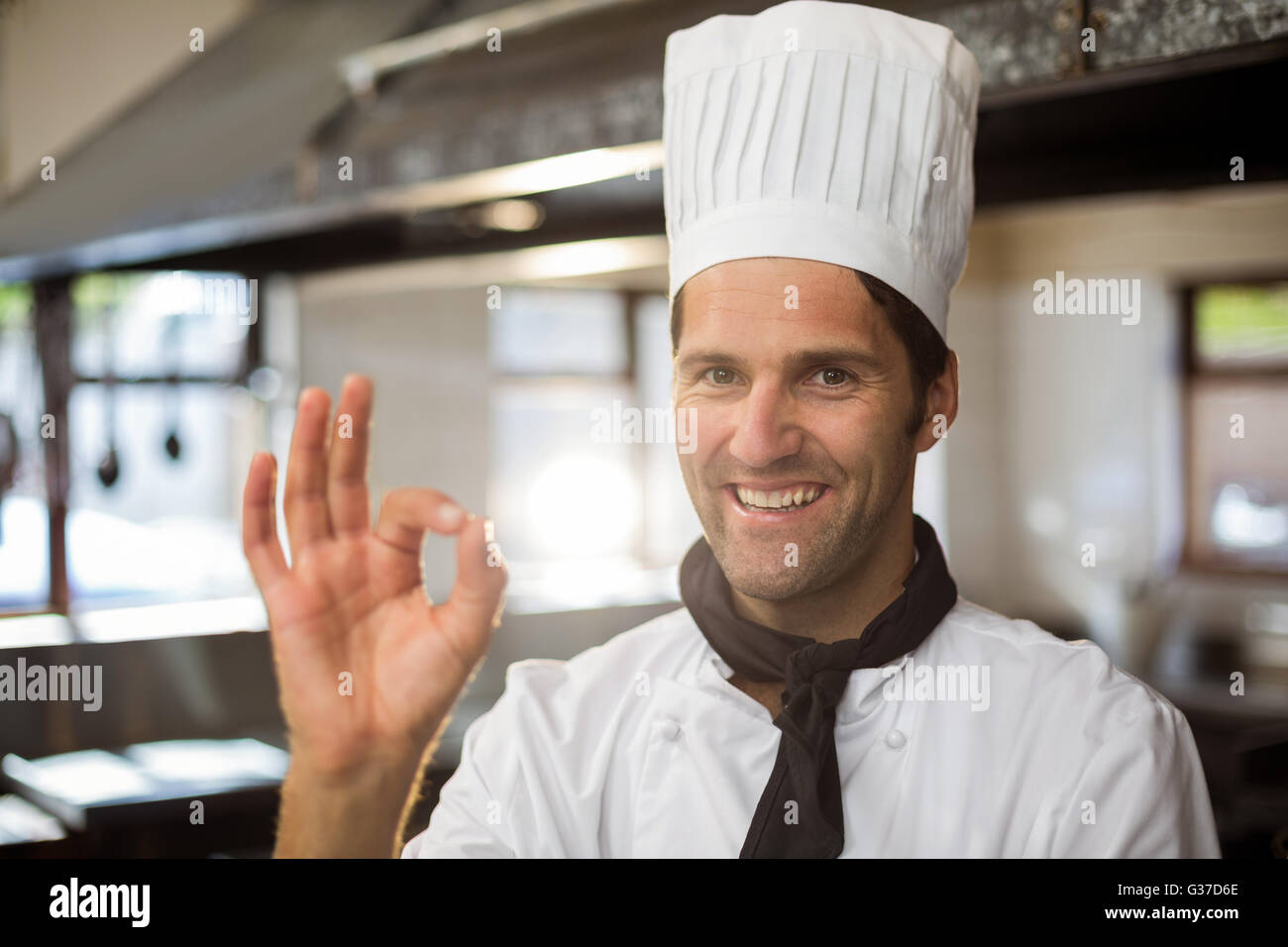 Portrait of happy chef making ok sign Stock Photo - Alamy