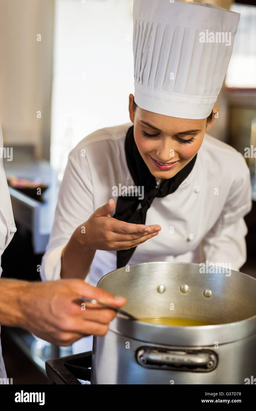 Head chef smelling the food Stock Photo - Alamy