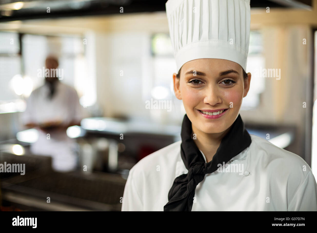 Portrait smiling young chef hi-res stock photography and images - Alamy