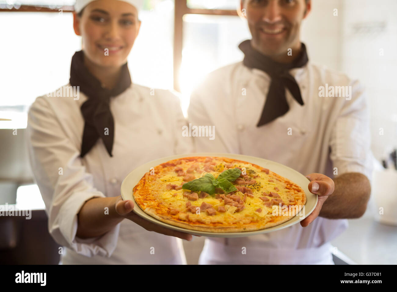 Female chef holding pizza hi-res stock photography and images - Alamy