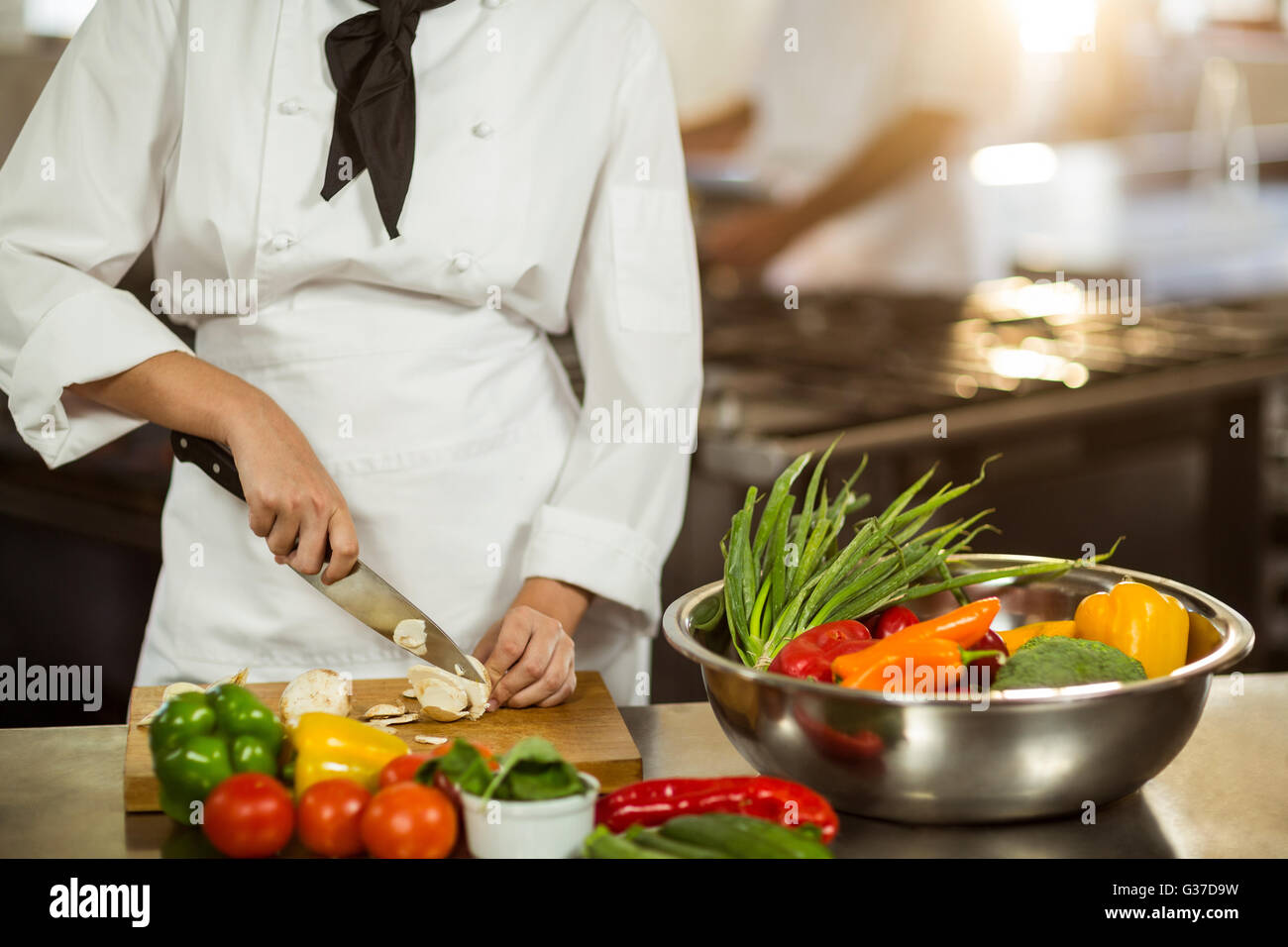 Mid section female chef cutting hi-res stock photography and images - Alamy