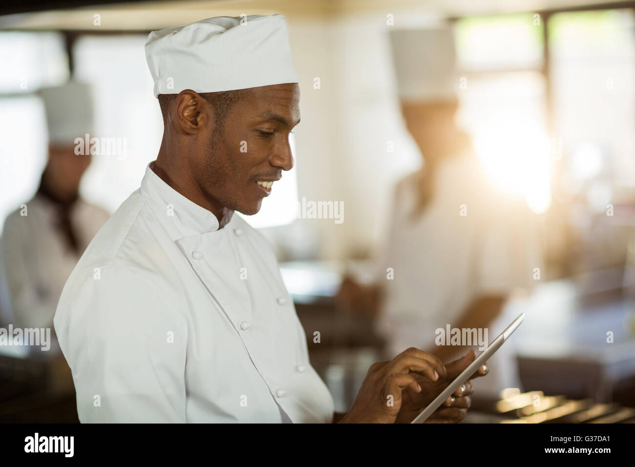 Young female chef using hi-res stock photography and images - Alamy