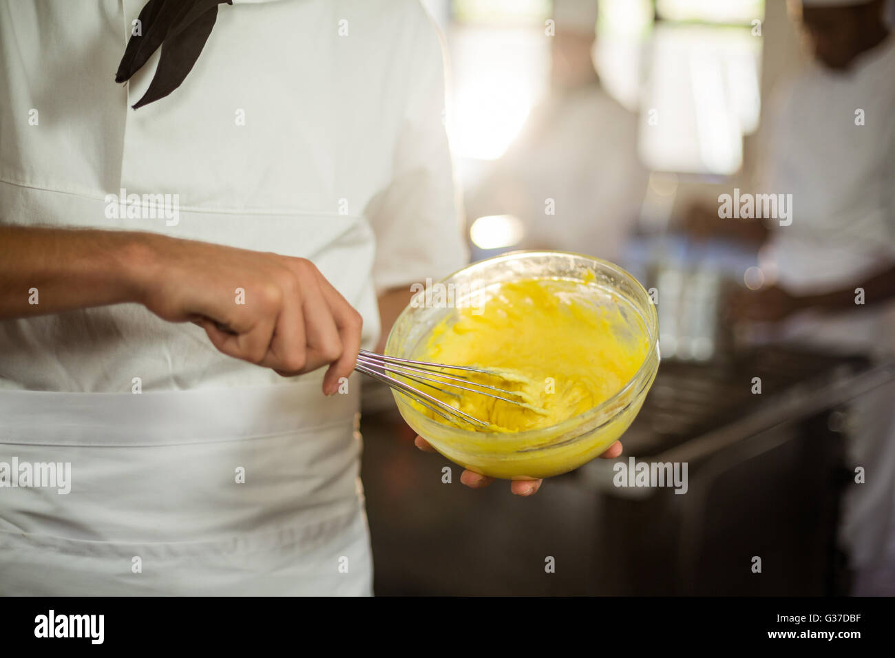 Mid section of chef mixing dough Stock Photo - Alamy