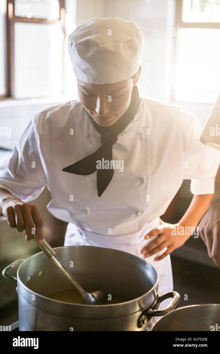 Chef stirring stove hi-res stock photography and images - Alamy