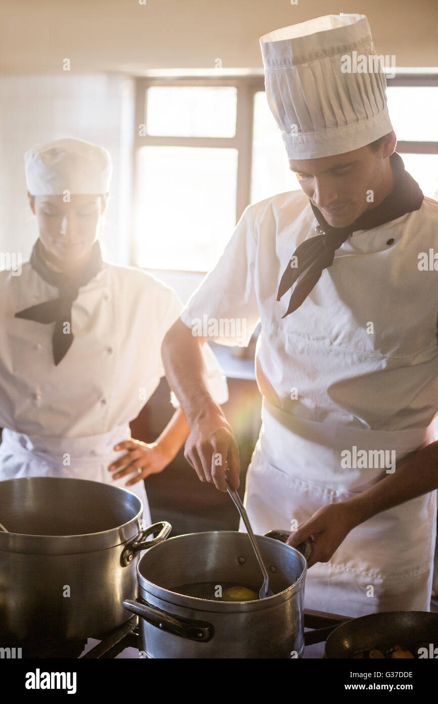 Chefs preparing food stove hi-res stock photography and images - Alamy