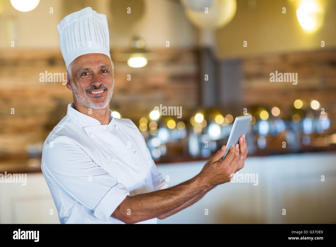 Portrait of chef using digital tablet Stock Photo - Alamy