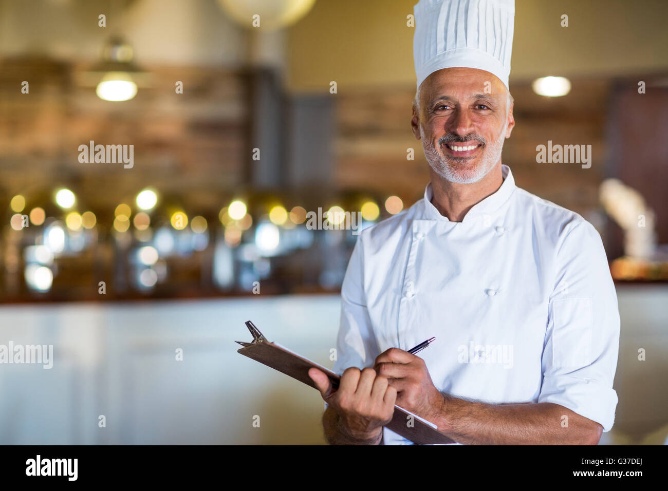 Portrait of chef holding a clipboard Stock Photo - Alamy