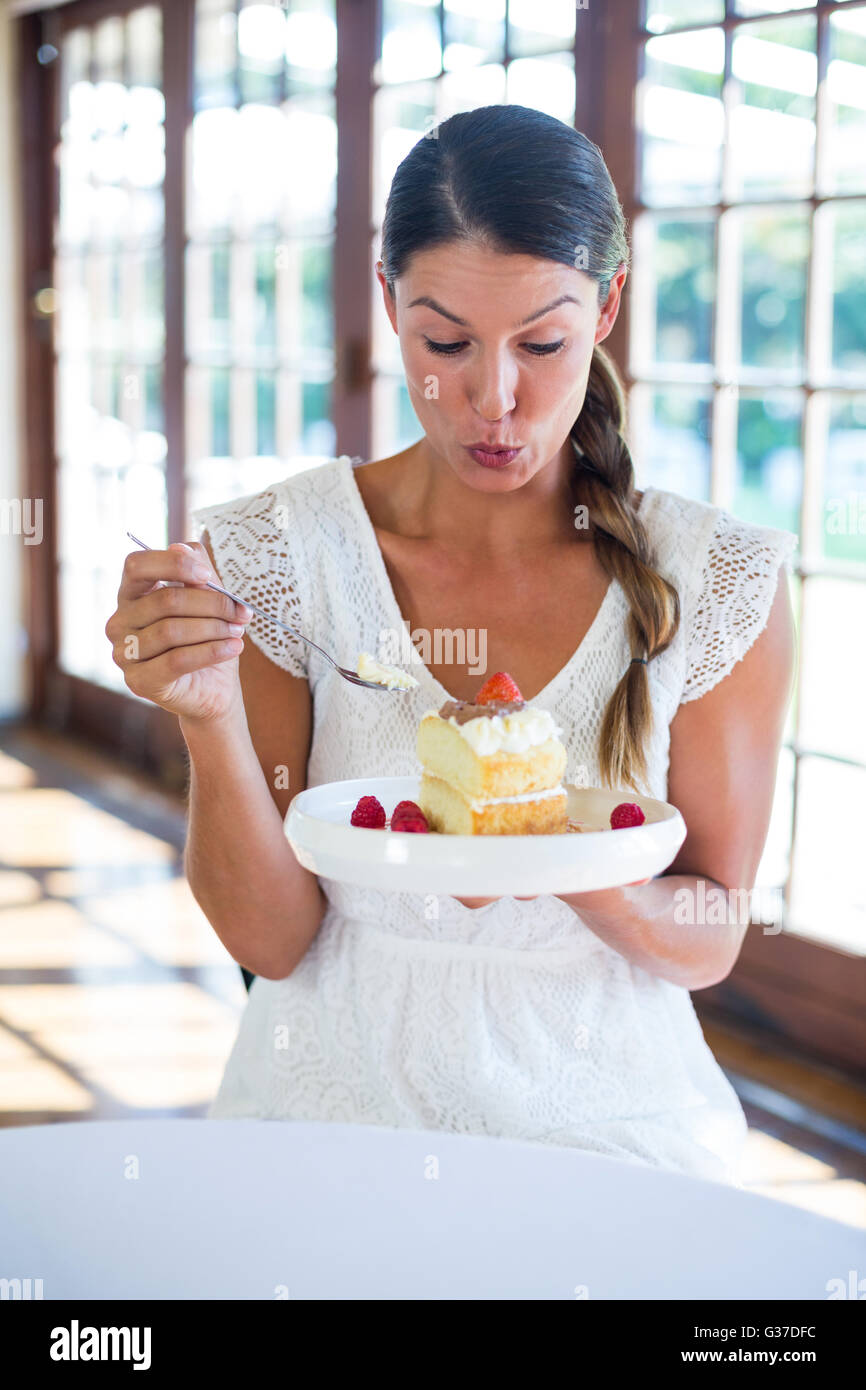 Woman having a pastry in restaurant Stock Photo - Alamy
