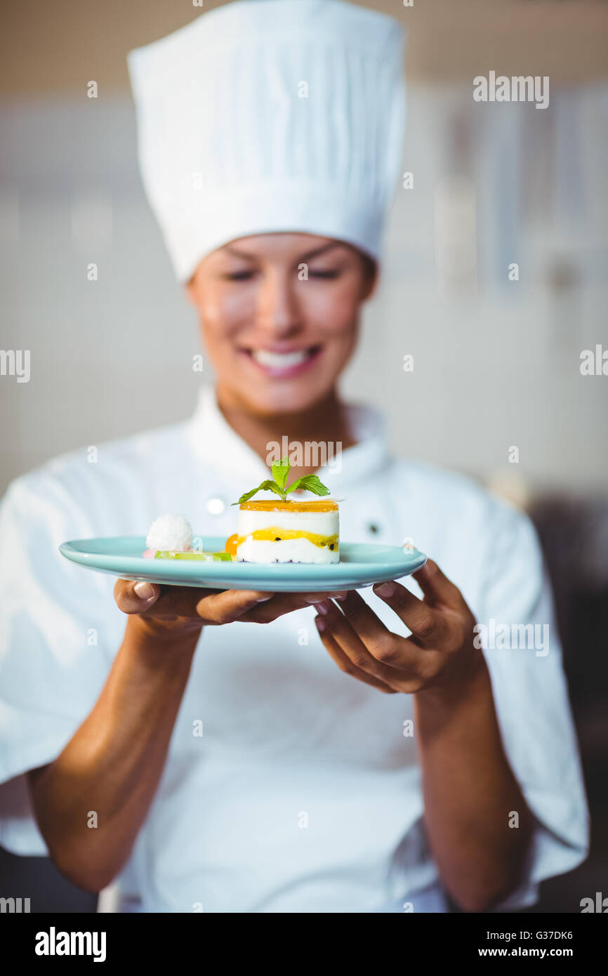Smiling chef presenting her food Stock Photo - Alamy