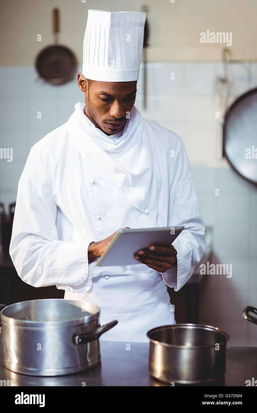 Chef using digital tablet Stock Photo - Alamy