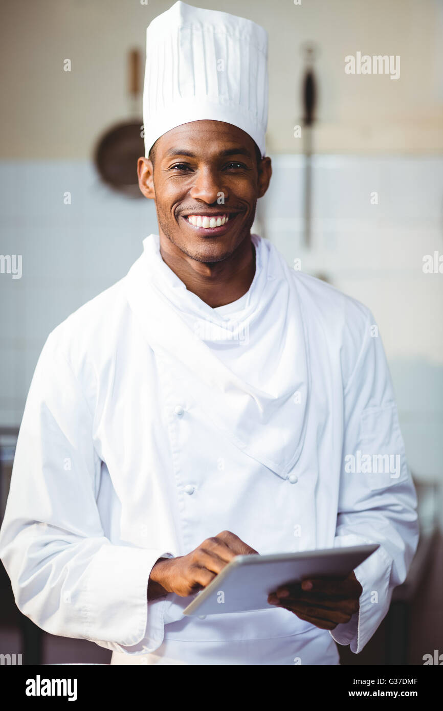Portrait of smiling chef using digital tablet Stock Photo - Alamy