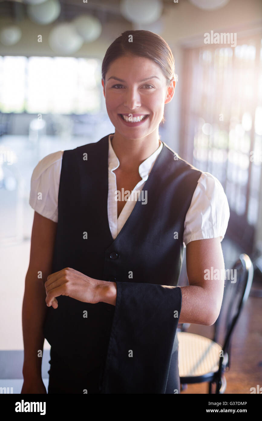Waitress with napkin draped over her hand Stock Photo - Alamy