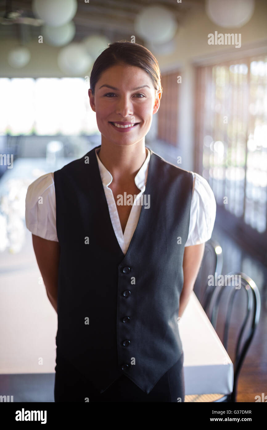 Portrait of smiling waitress Stock Photo - Alamy