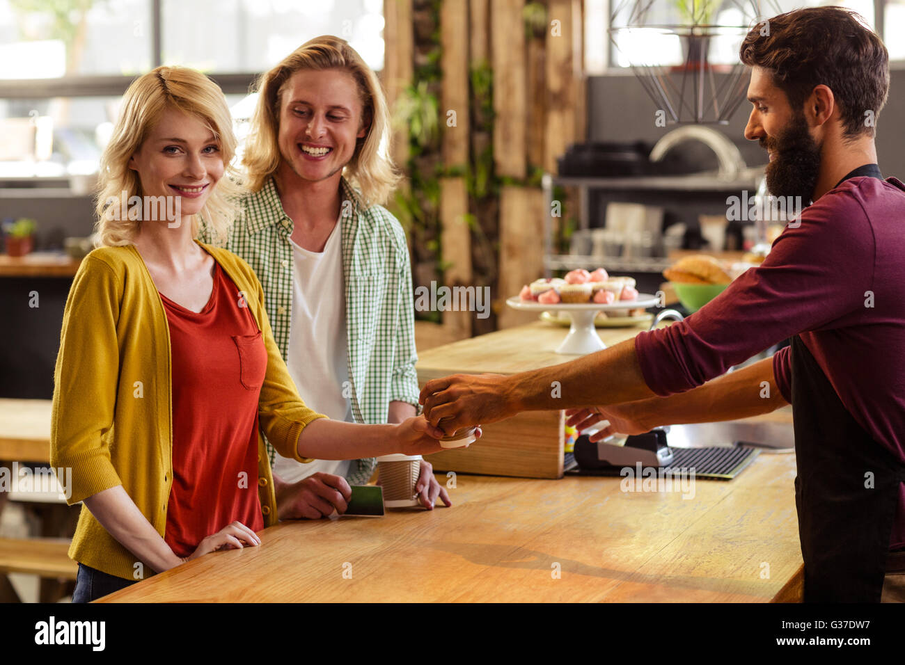 Seller collecting payment Stock Photo - Alamy