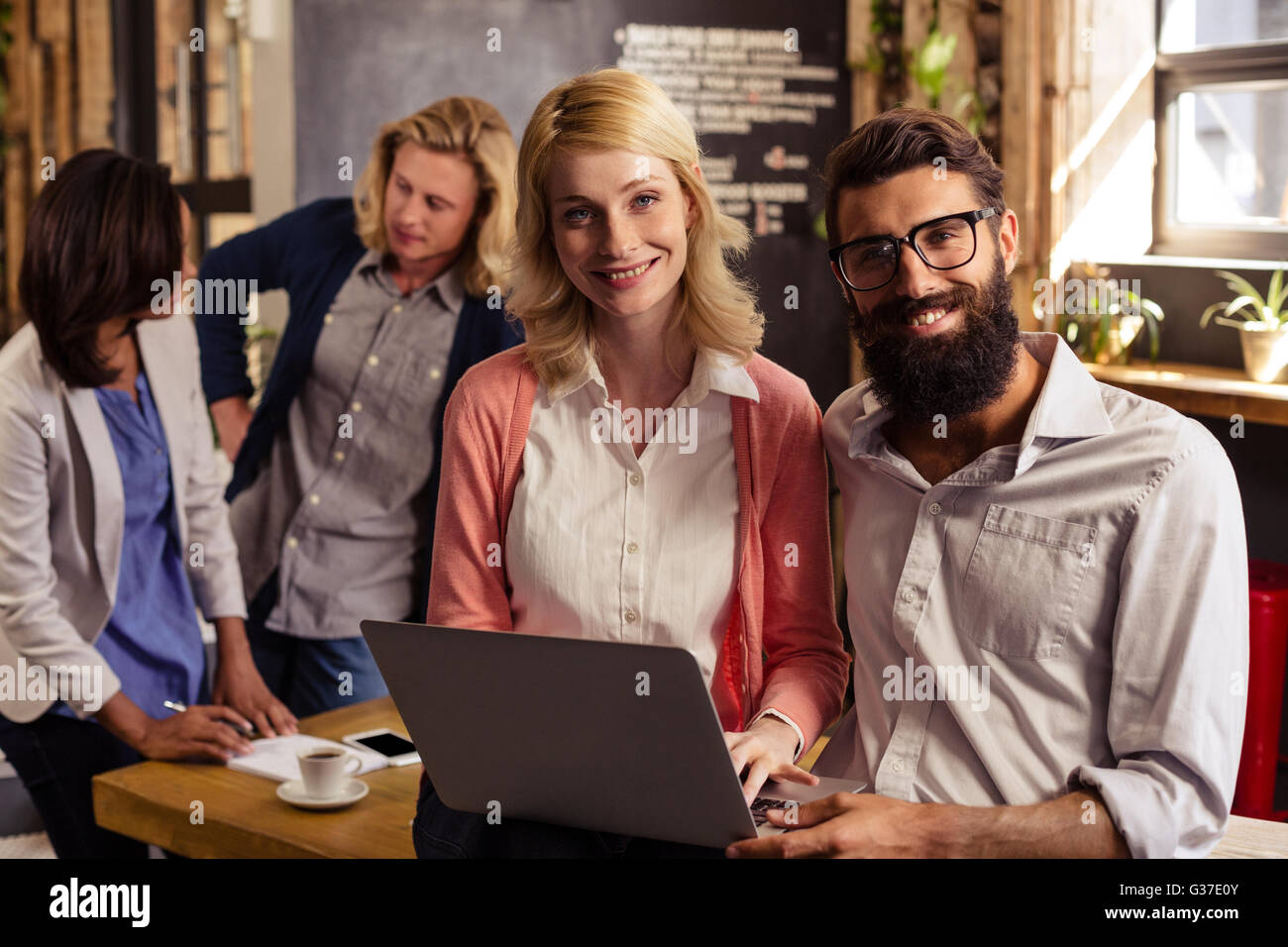 Team of hipsters working Stock Photo - Alamy