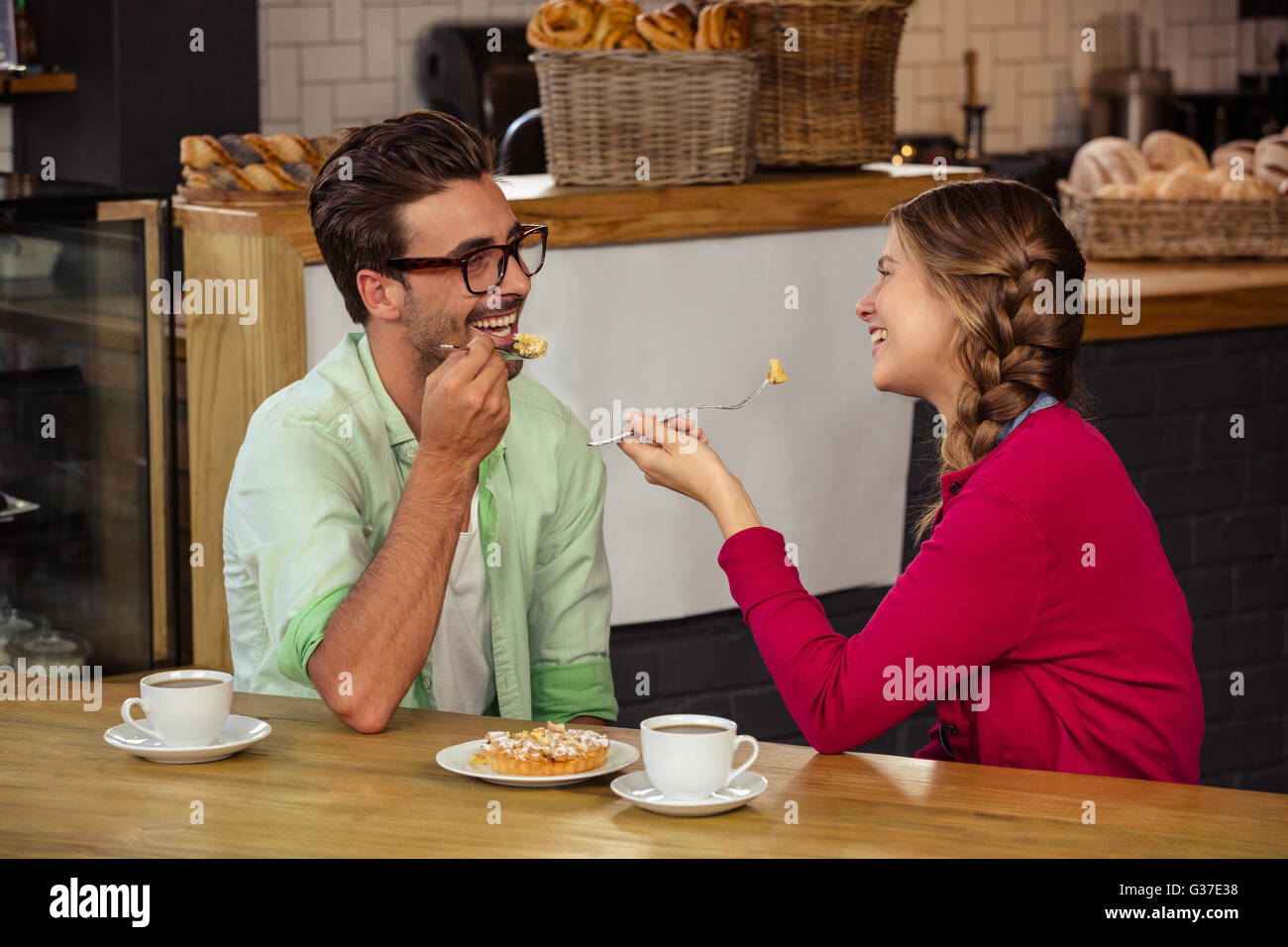 Man eating cake sitting hi-res stock photography and images - Alamy