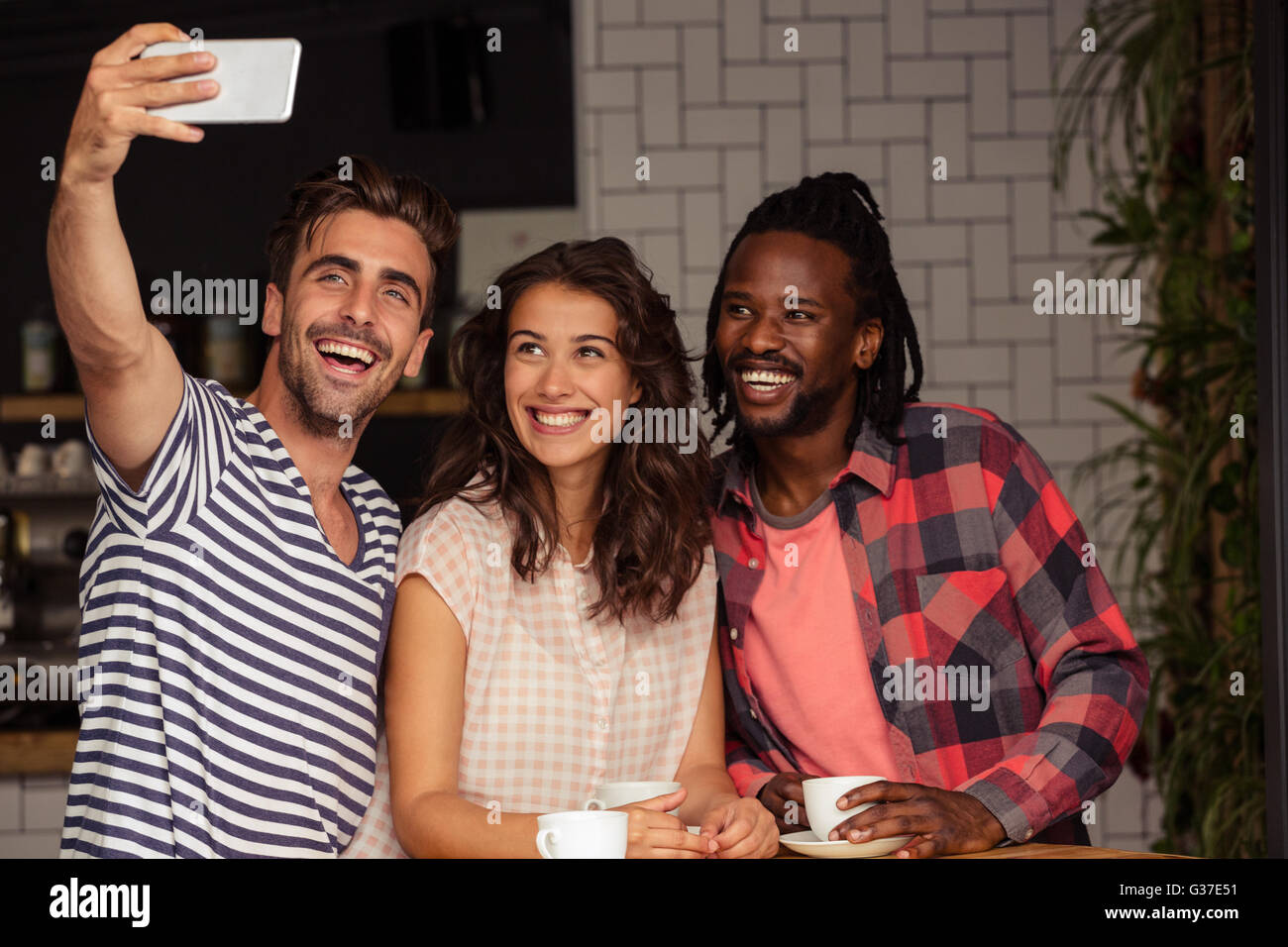 Friends taking a selfie Stock Photo - Alamy