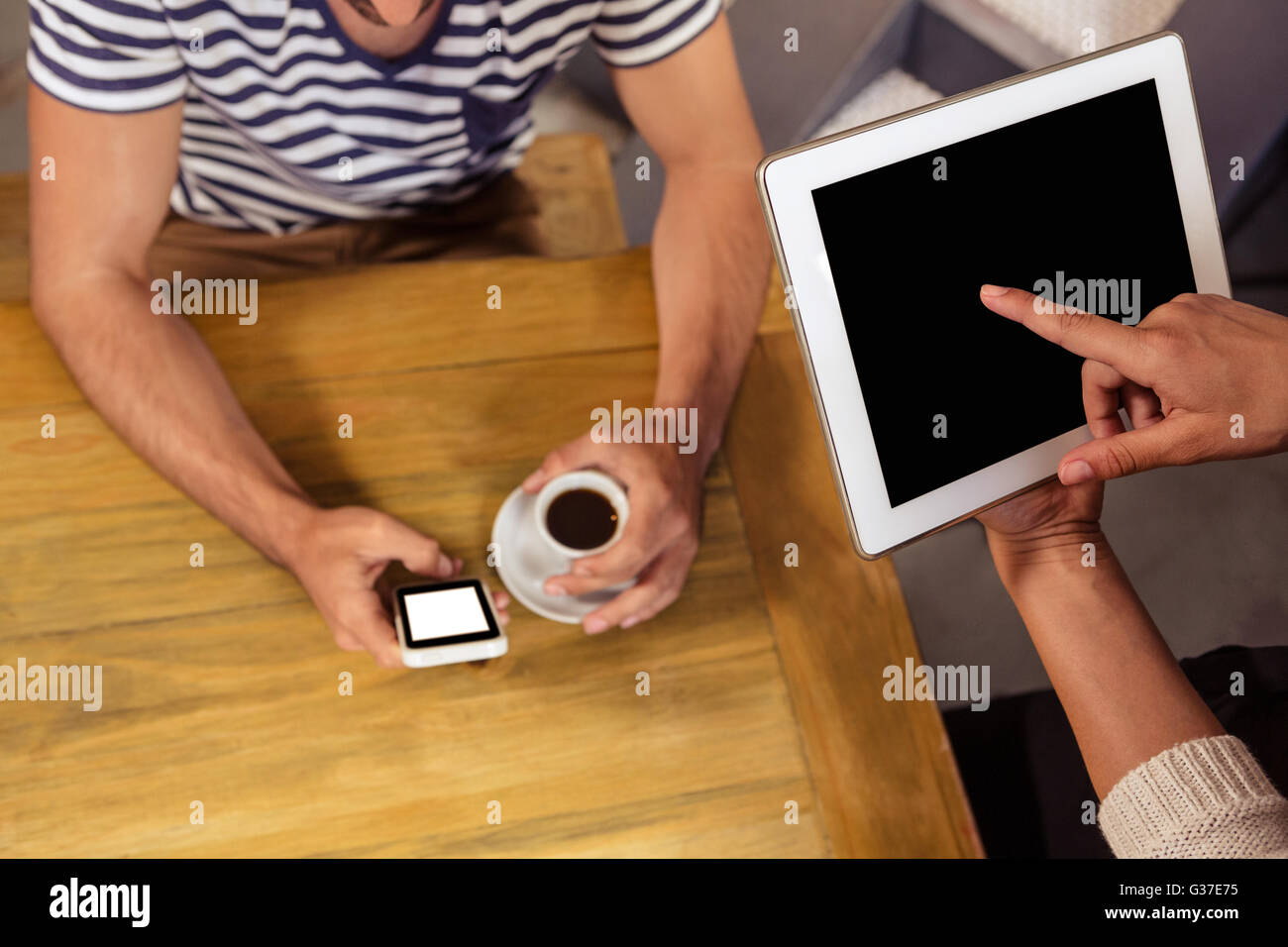 Waitress taking order with a tablet computer Stock Photo - Alamy