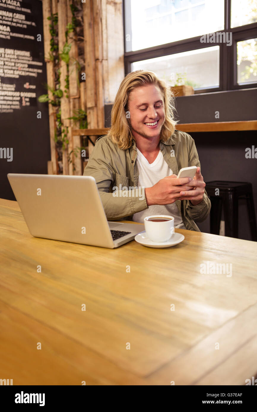 Happy man using a smartphone Stock Photo - Alamy