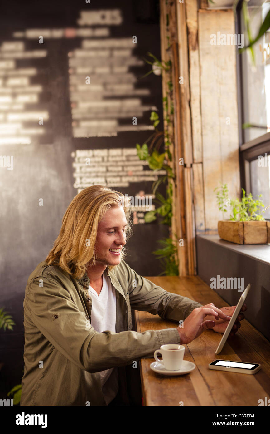 Young man tablet smartphone in hi-res stock photography and images - Alamy
