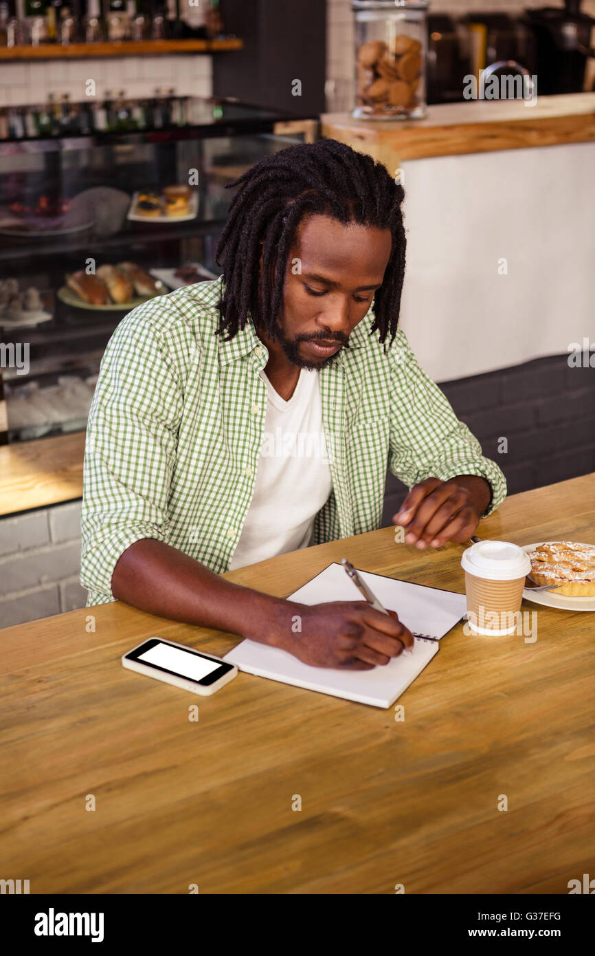 Man notebook writing hi-res stock photography and images - Alamy