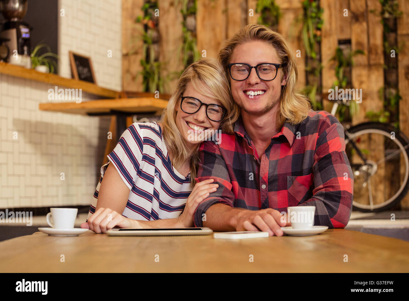 Couple sitting table hi-res stock photography and images - Alamy
