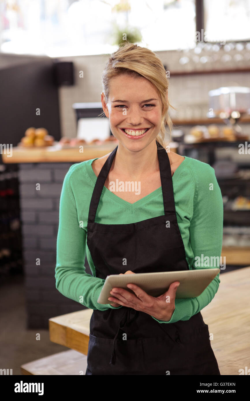 Waitress using a tablet Stock Photo - Alamy